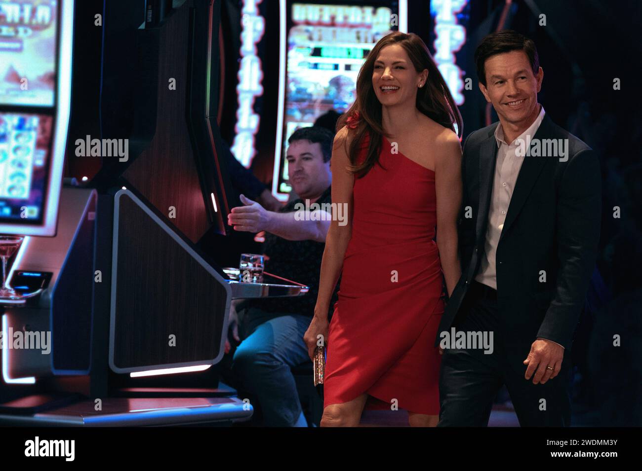 MARK WAHLBERG and MICHELLE MONAGHAN in THE FAMILY PLAN (2023), directed by SIMON CELLAN JONES ...