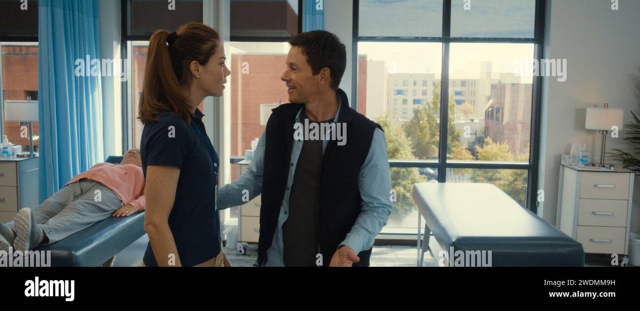 MARK WAHLBERG and MICHELLE MONAGHAN in THE FAMILY PLAN (2023), directed by SIMON CELLAN JONES ...