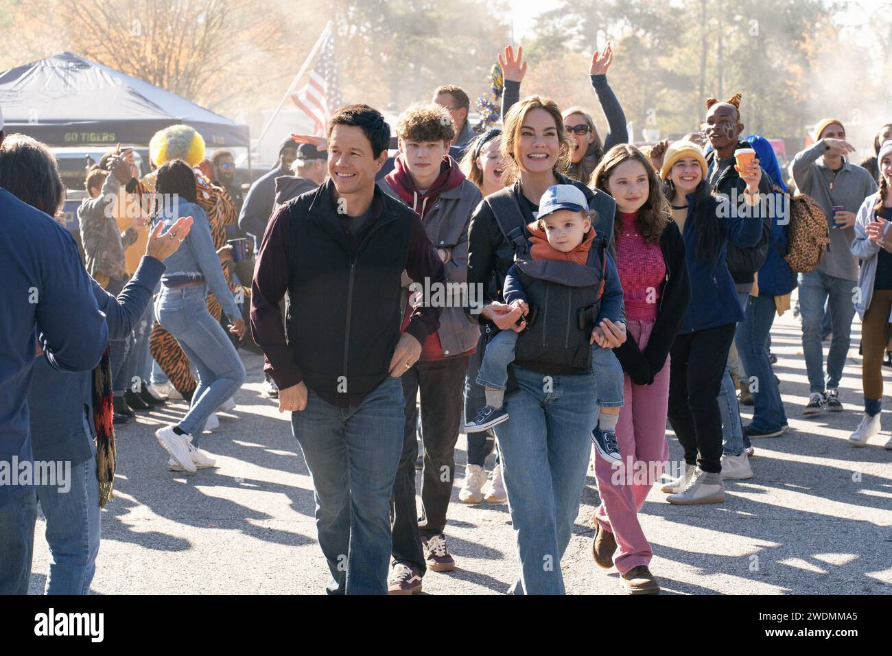 MARK WAHLBERG and MICHELLE MONAGHAN in THE FAMILY PLAN (2023), directed ...