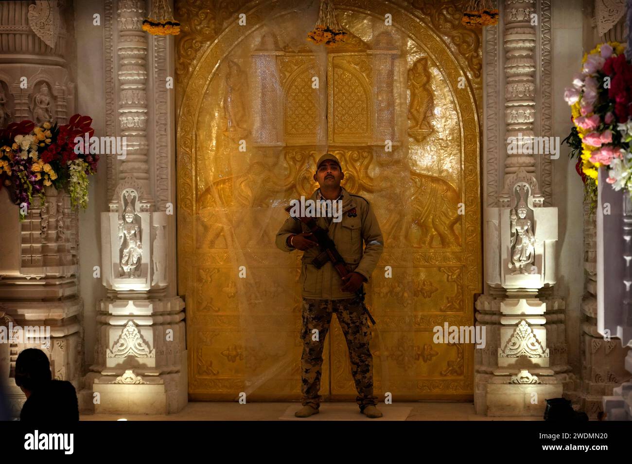 A security man stands guard outside sanctum center of a temple ...