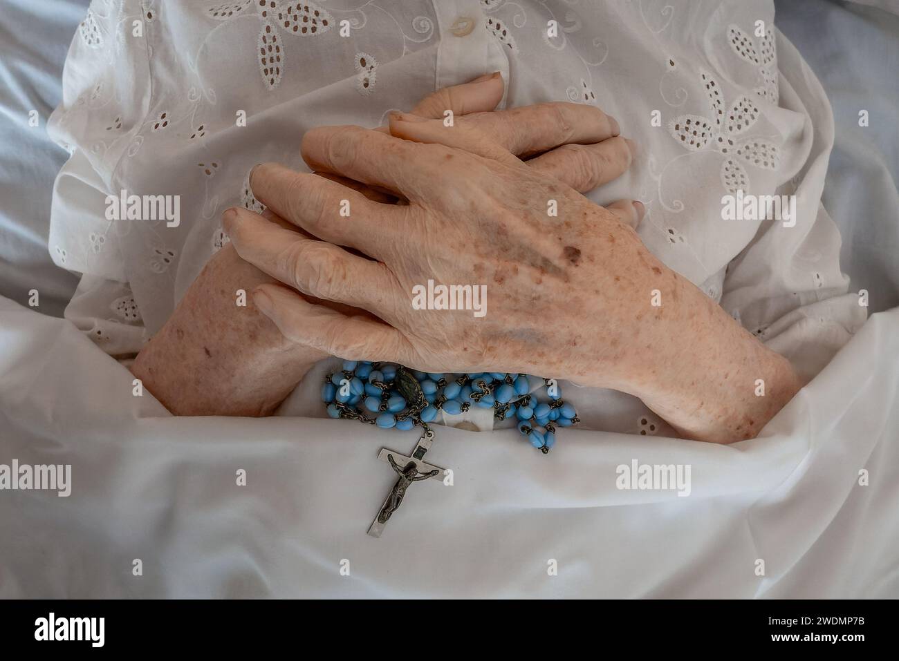 Brighton, May 13th 2019: The crossed hands of a recently-deceased woman ...