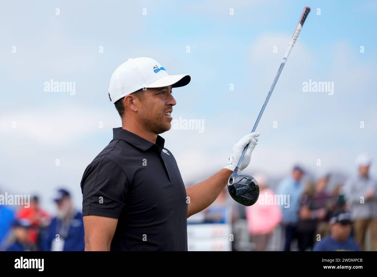 Xander Schauffele watches his tee shot on the first hole of the Pete Dye Stadium Course during ...