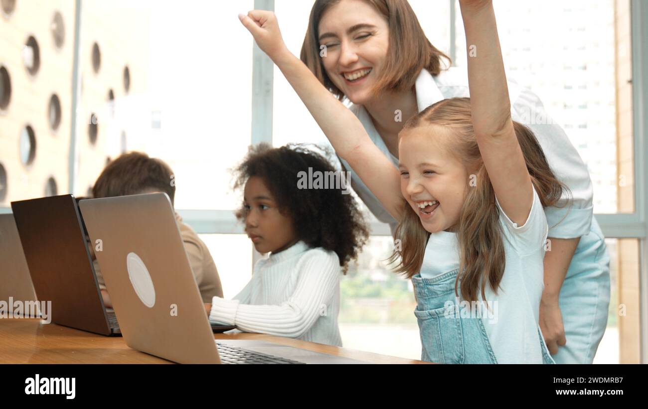 Smart student celebrate successful project by raising hand up while ...