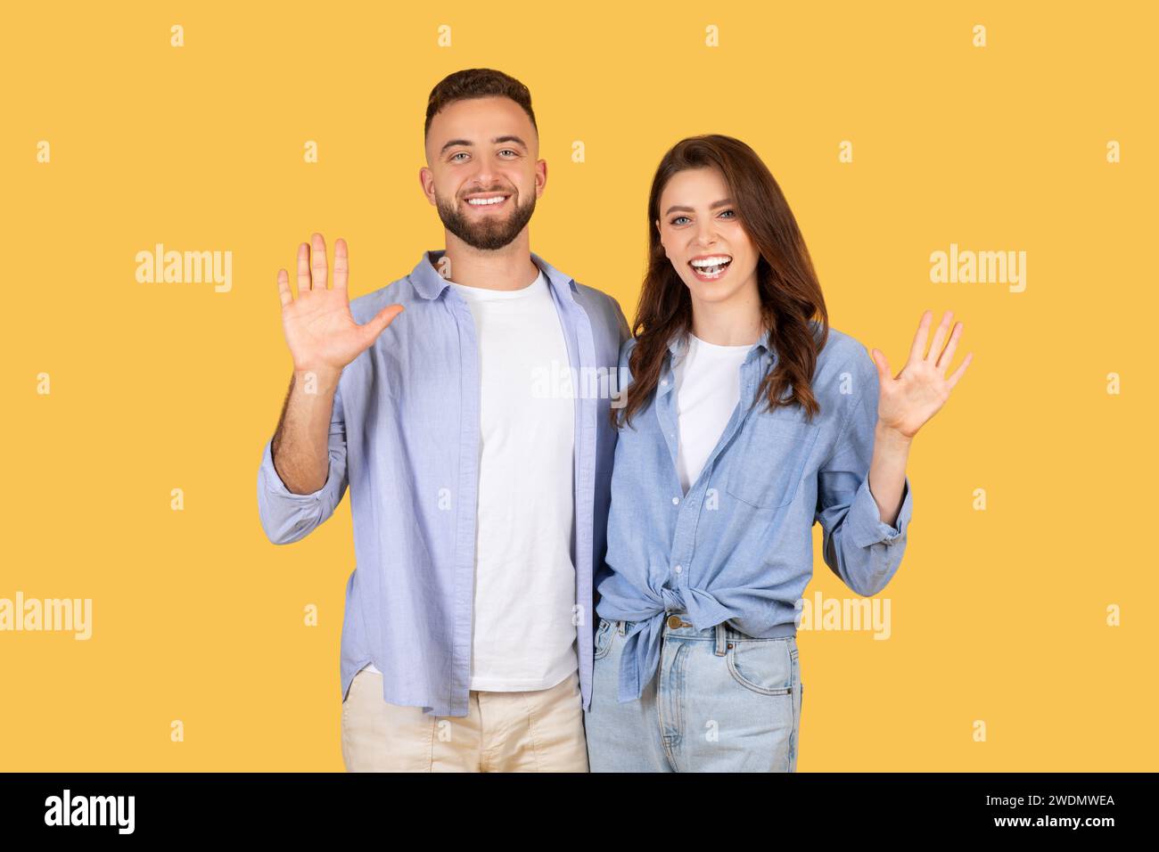 Hello welcoming young man waving hi-res stock photography and images ...