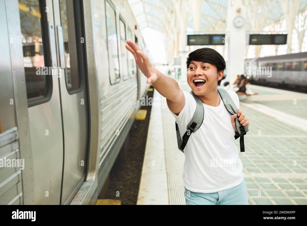 Tourist asian man with backpack running to catch the train Stock Photo ...