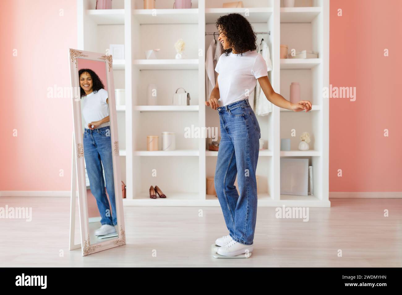 Woman dancing in front mirror hi-res stock photography and images - Alamy