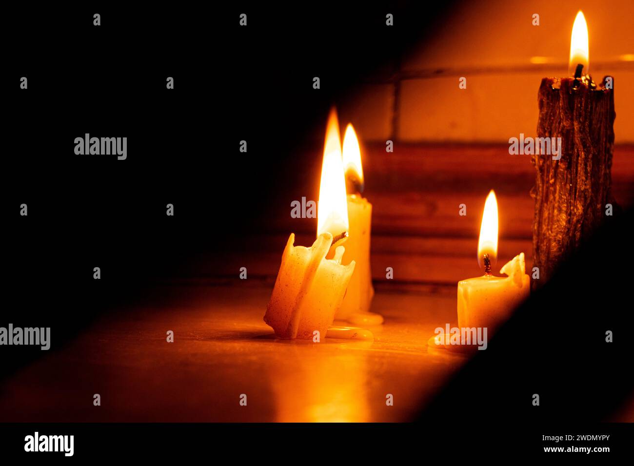 Candles in the dark on the floor in the shadows, candle flame, fire, no ...