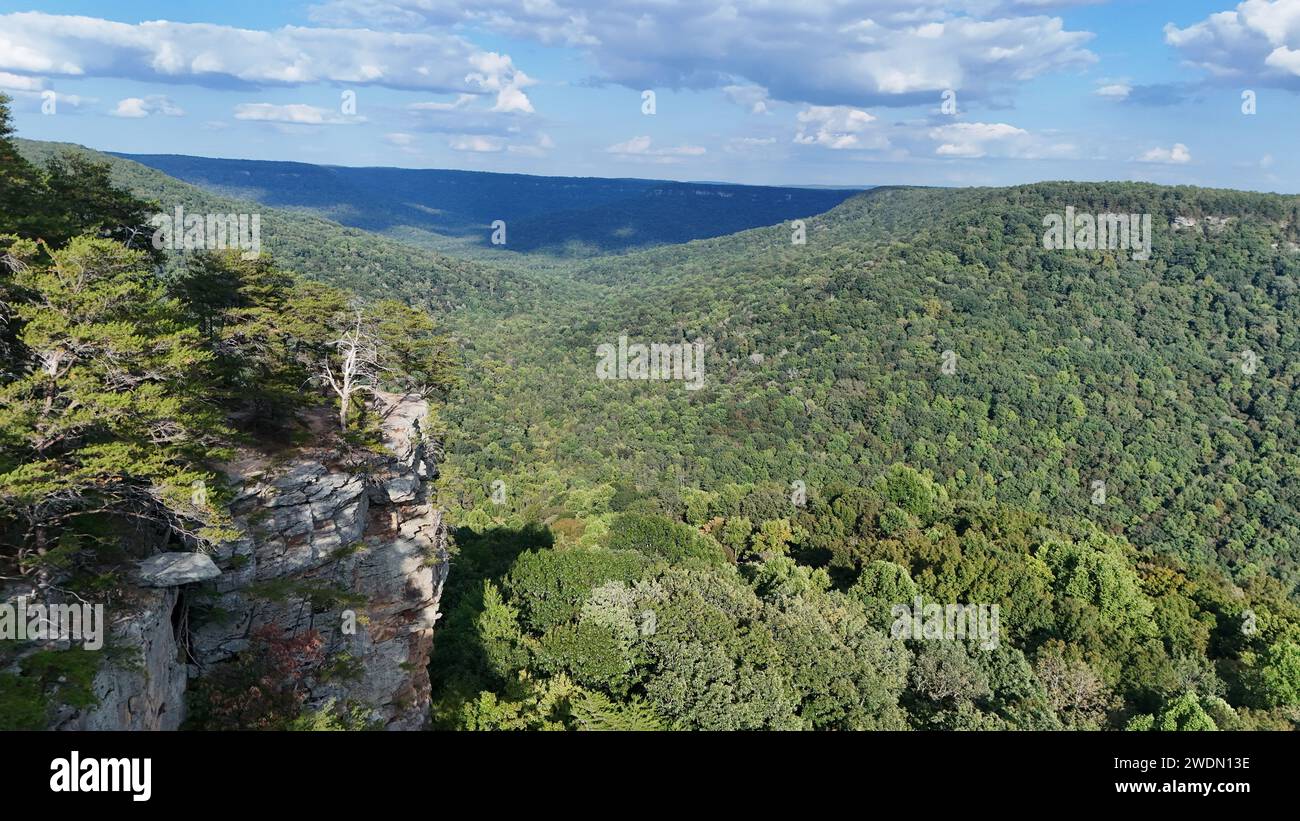 A breathtaking aerial view of a scenic valley from a cliff's edge ...