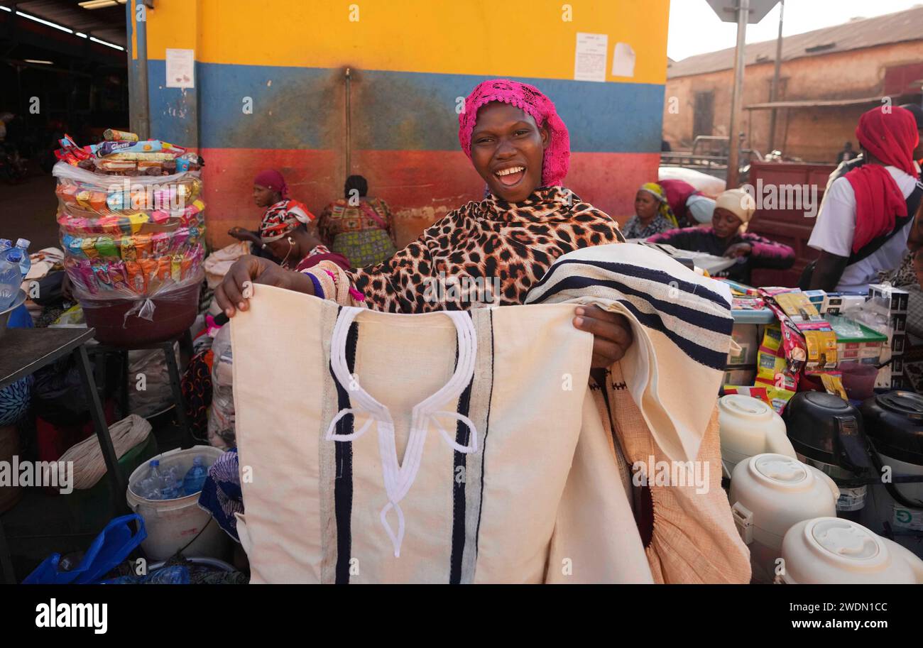 A women sells locally made clothes on the street in Korhogo, Ivory ...