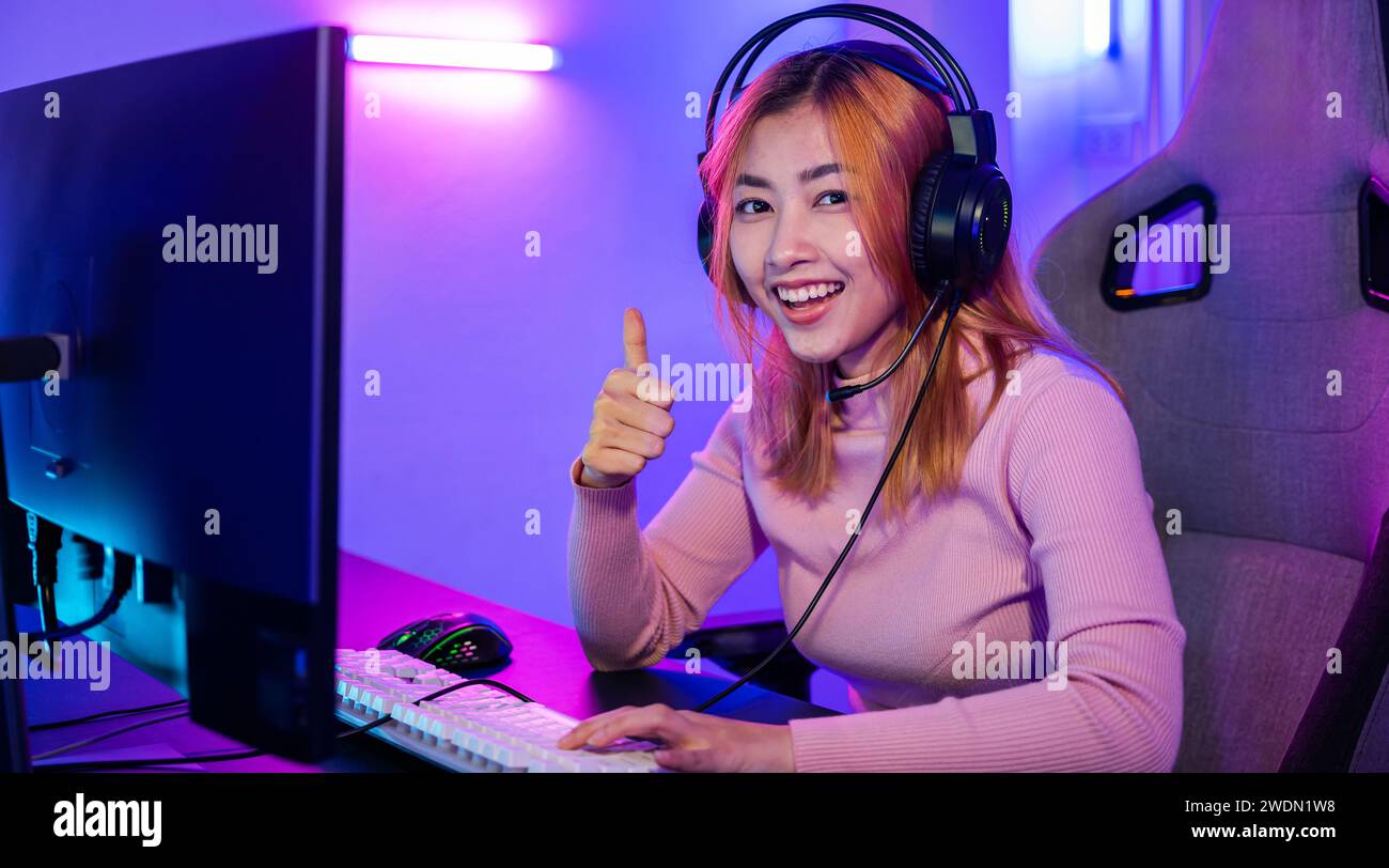 Gamer playing online game wear gaming headphones looking to camera ...