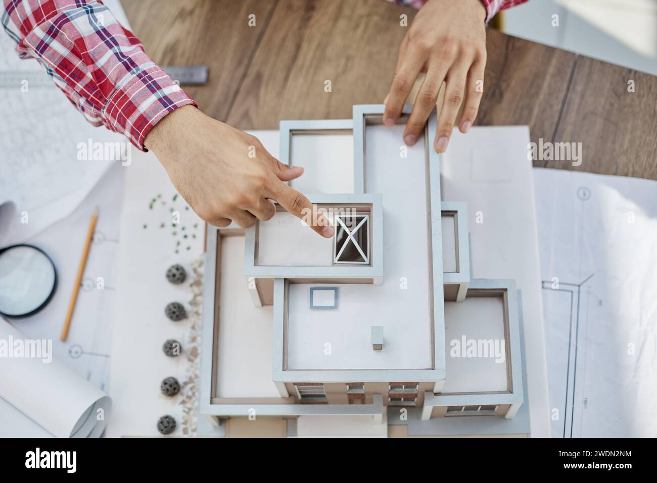 Executive working on architectural model hi-res stock photography and ...