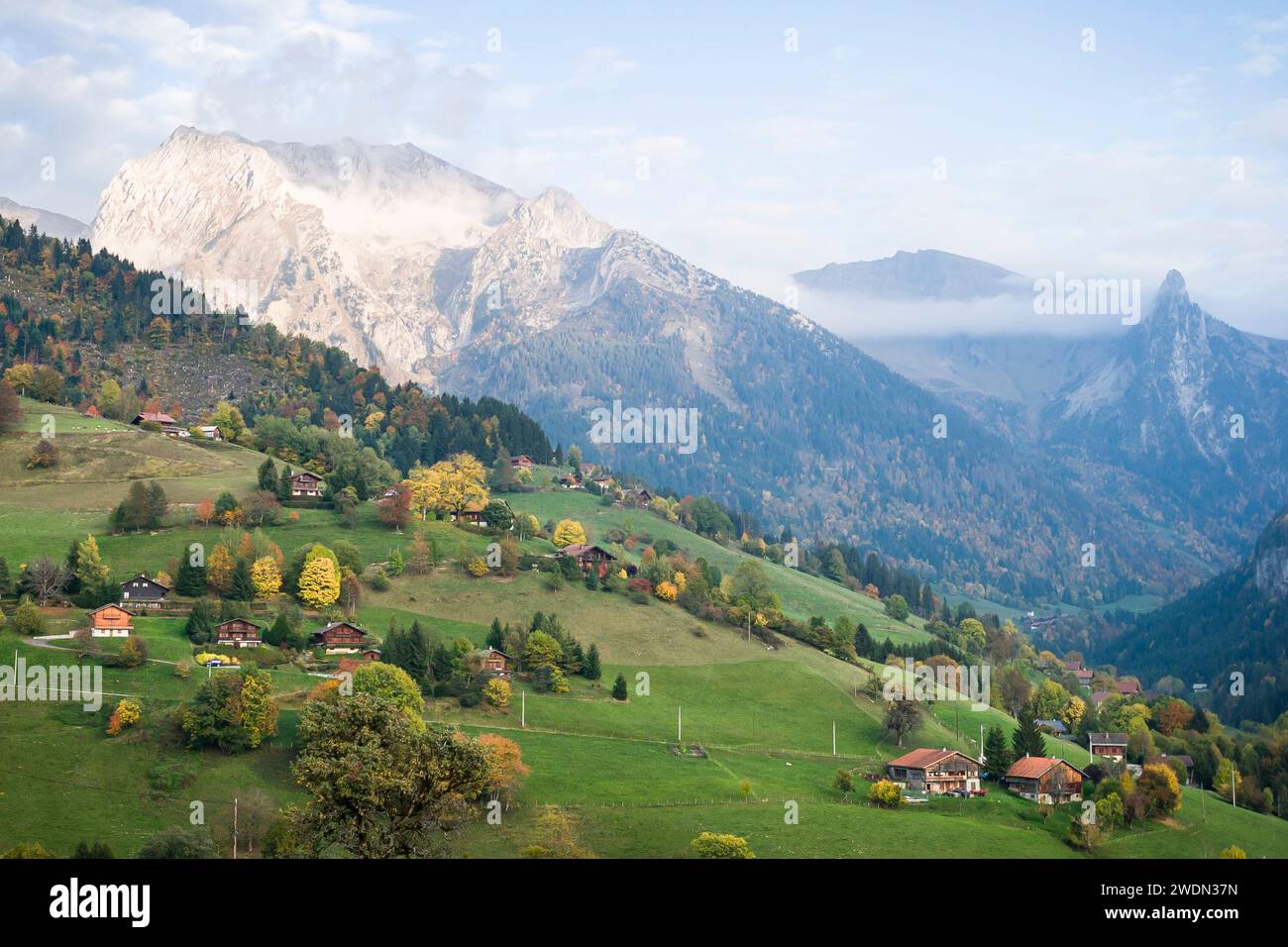 Alpine chalets on a hillside in Manigod commune near Annecy. Aravis ...