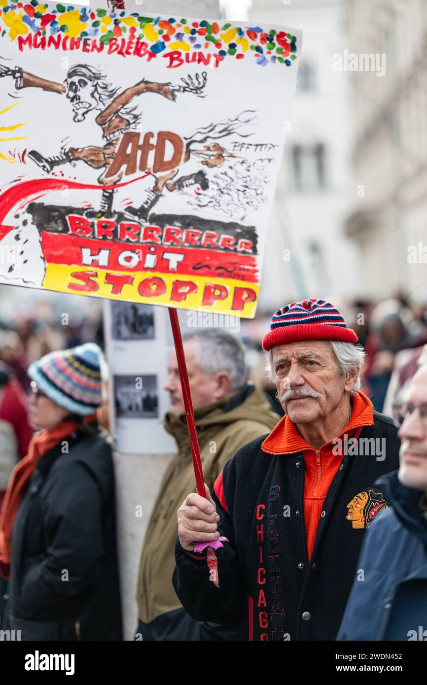 A man carrying a placard against the AfD party at a demonstration ...