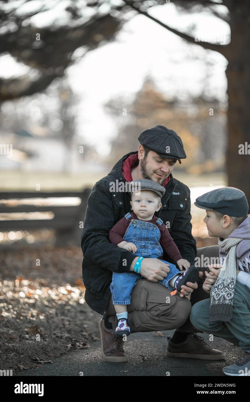 Fathers Day. Brothers and their dad enjoying time together in nature ...