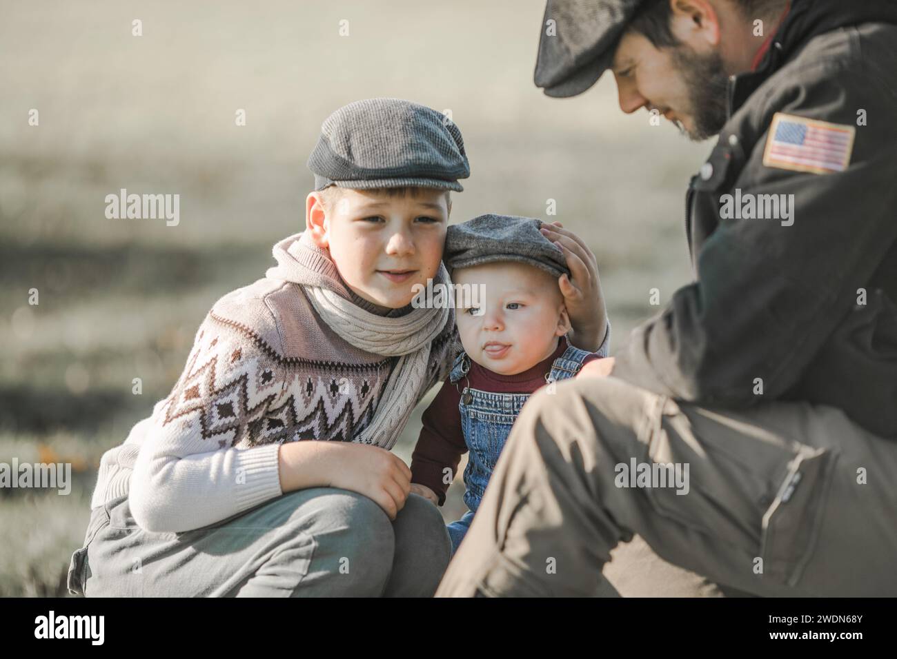 Fathers Day. Brothers and their dad enjoying time together in nature ...