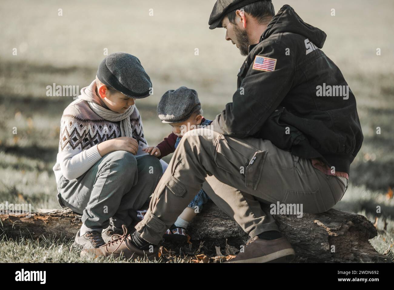 Fathers Day. Brothers and their dad enjoying time together in nature ...