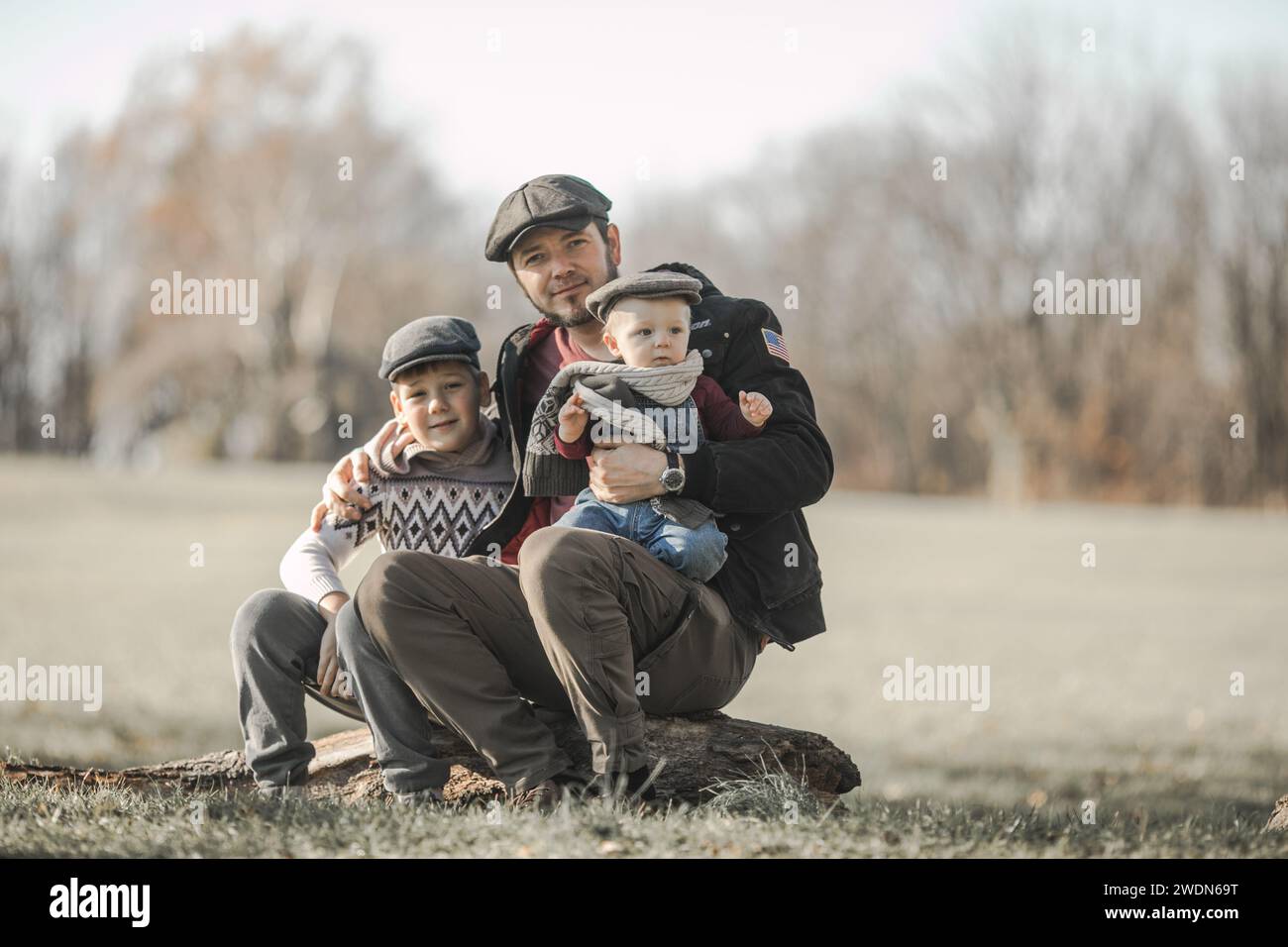 Fathers Day. Brothers and their dad enjoying time together in nature ...