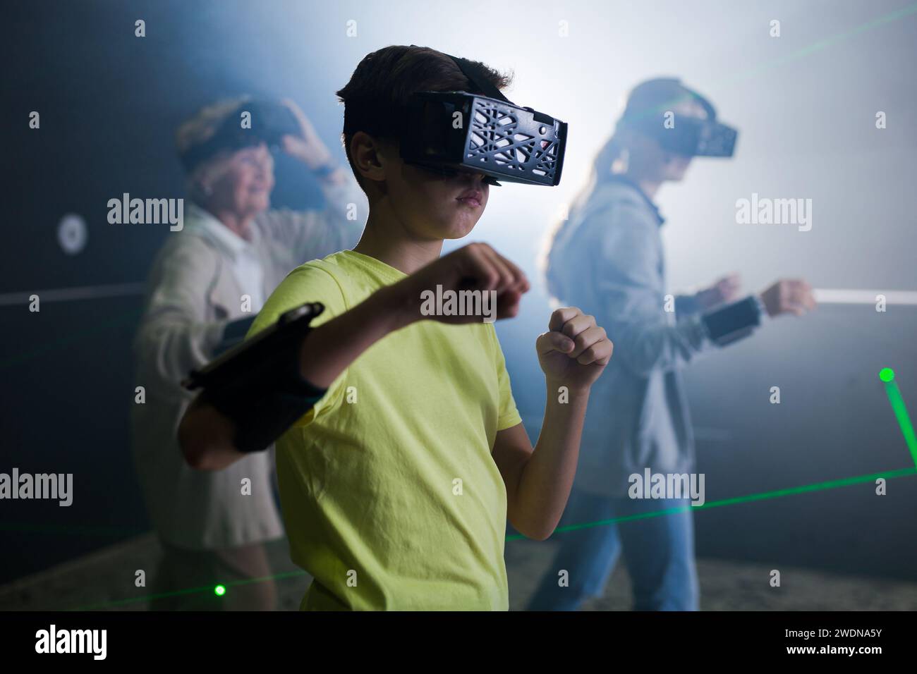 Boy playing VR games with his family Stock Photo - Alamy