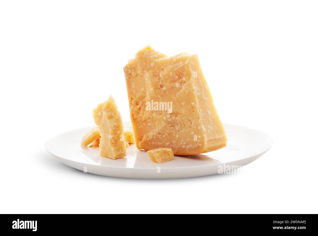 Aged parmesan cheese or parmigiano reggiano on a white plate isolated ...