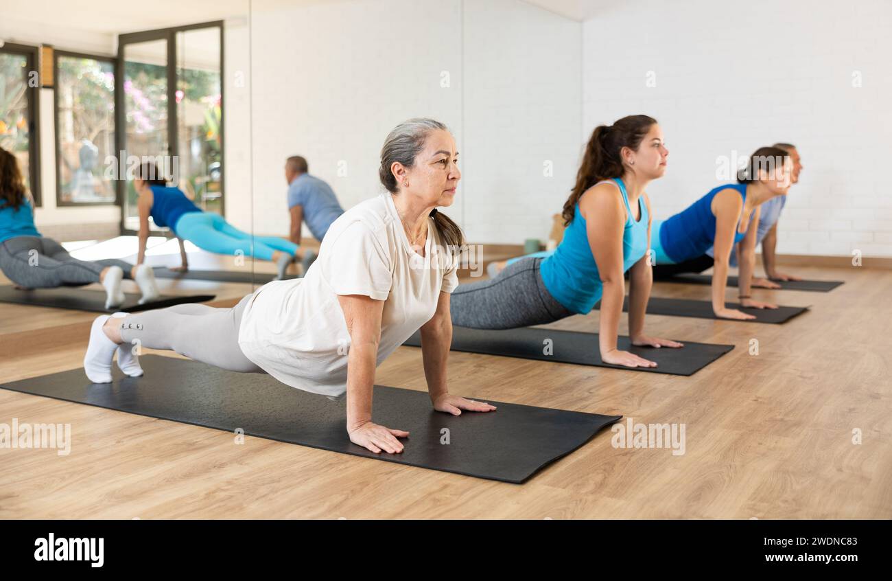 Senior woman doin back bending asana Urdhva Mukha Shvanasana Stock ...
