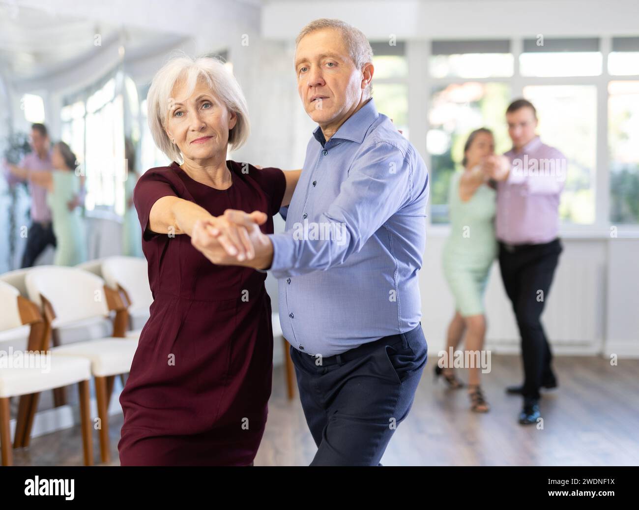 Senior woman latin dance class hi-res stock photography and images - Alamy