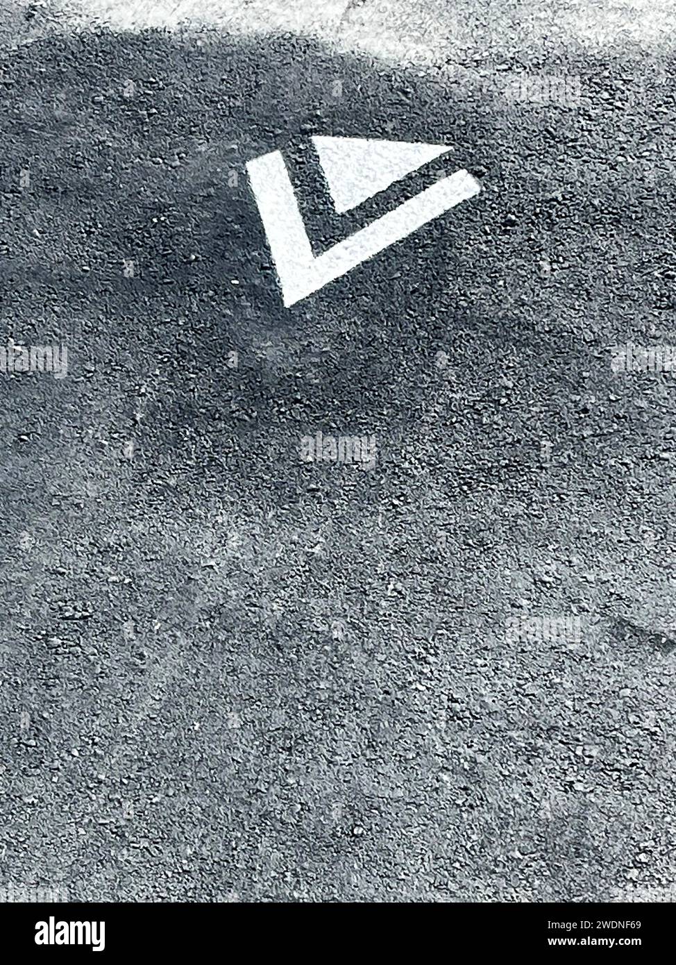 Pumptrack guidance: White arrows on asphalt, directing the exhilarating ...