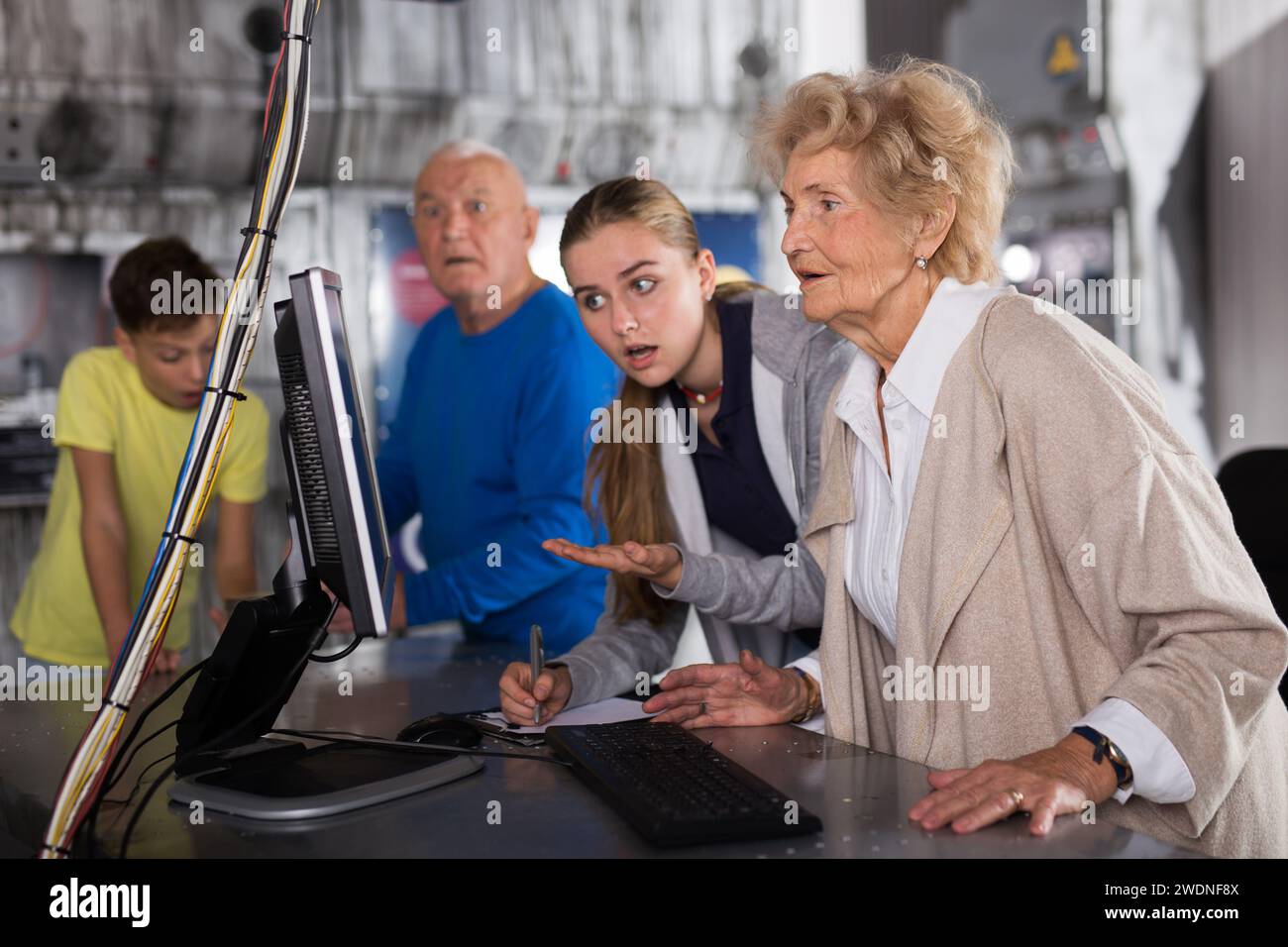 Positively minded family together solve puzzles in a quest room in form ...