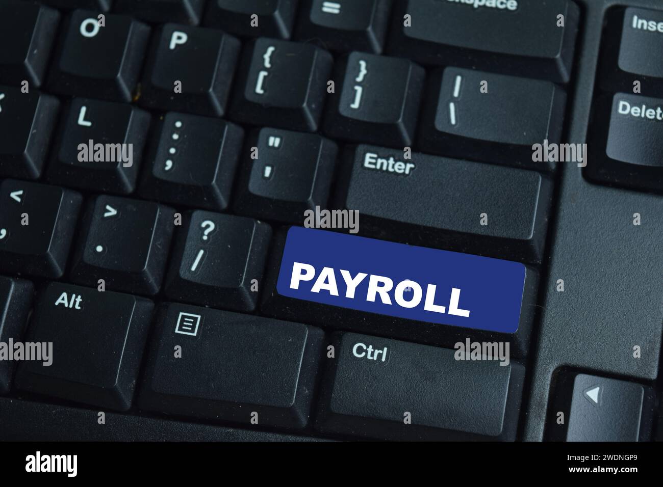 Payroll write on keyboard isolated on laptop background Stock Photo - Alamy