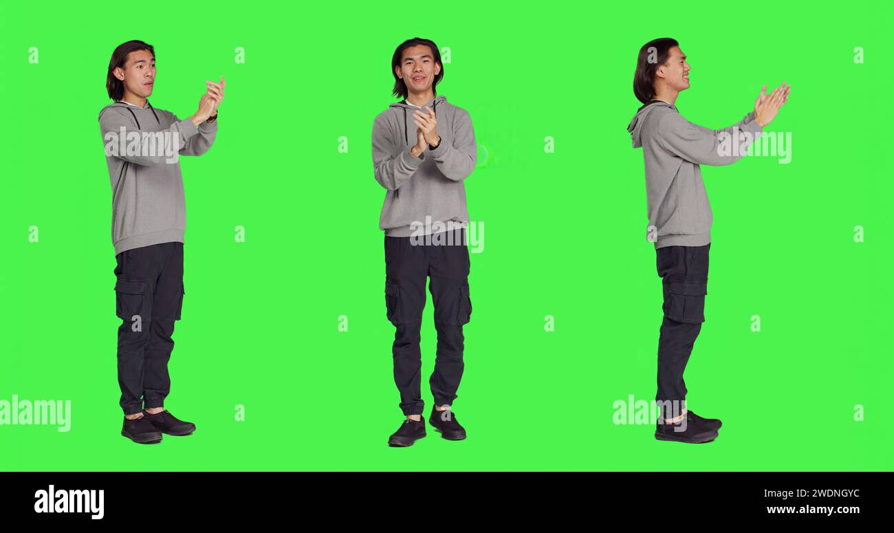 Asian happy guy applauding a person, clapping hands to show his ...