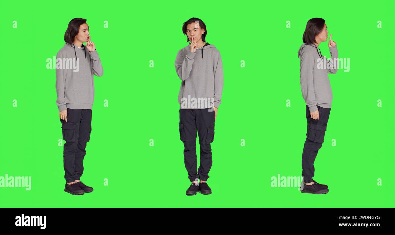 Adult doing hush secret sign over greenscreen, expressing secrecy ...