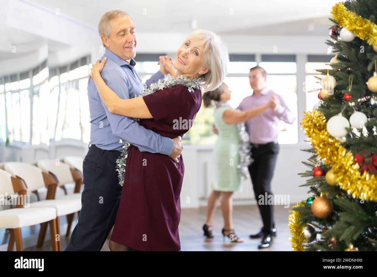 Elderly man and elderly woman dance waltz Stock Photo - Alamy