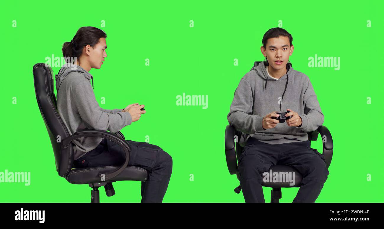 Asian gamer playing video games over greenscreen background, using ...