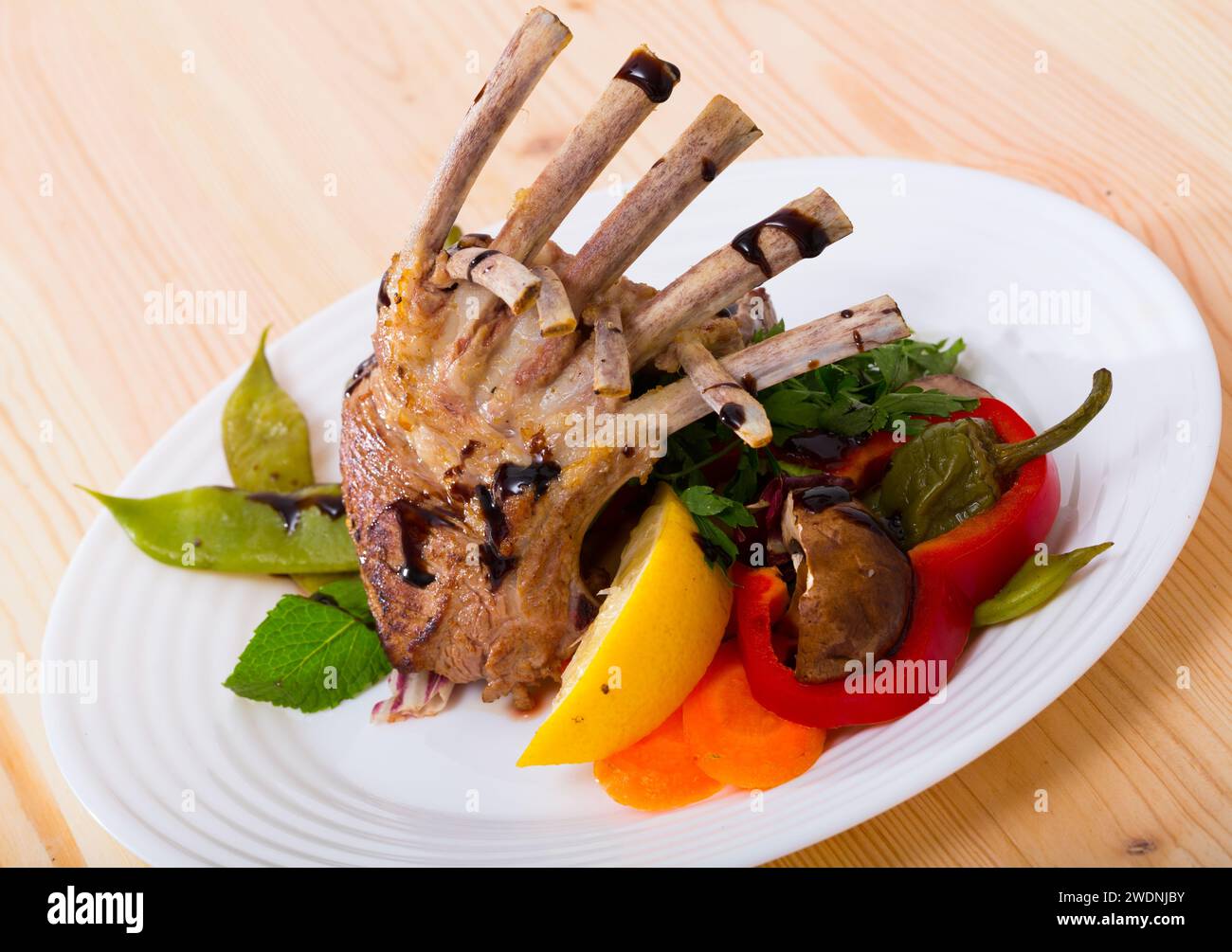Roasted rack of mutton with vegetables Stock Photo - Alamy