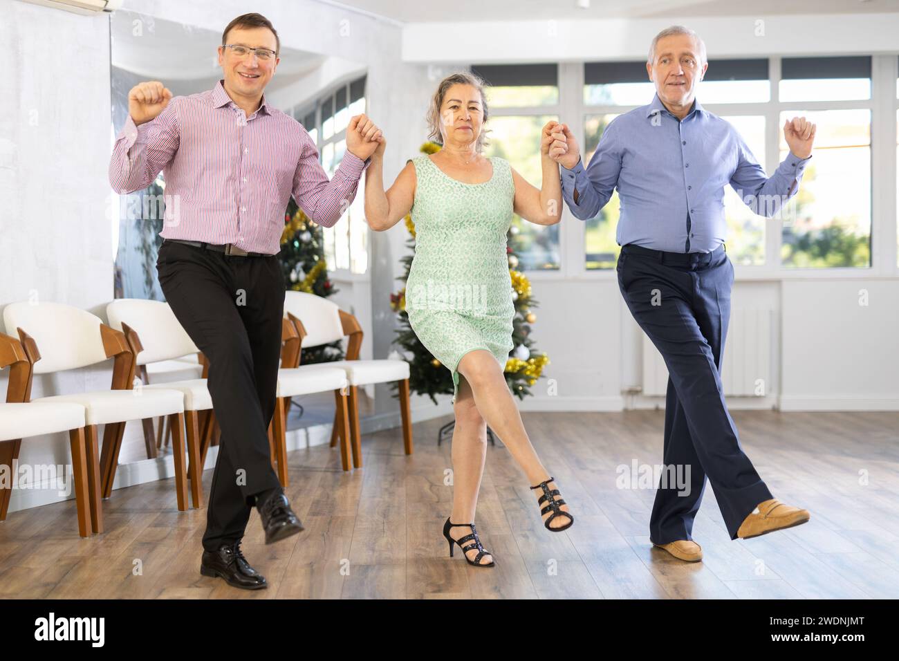 Group of men and women dancing folk dance Stock Photo - Alamy