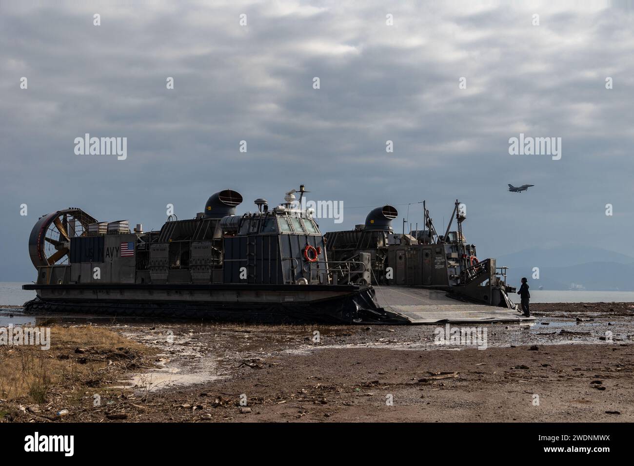 A U.S. Navy Landing Craft Air Cushion (LCAC) lands on the beach prior ...