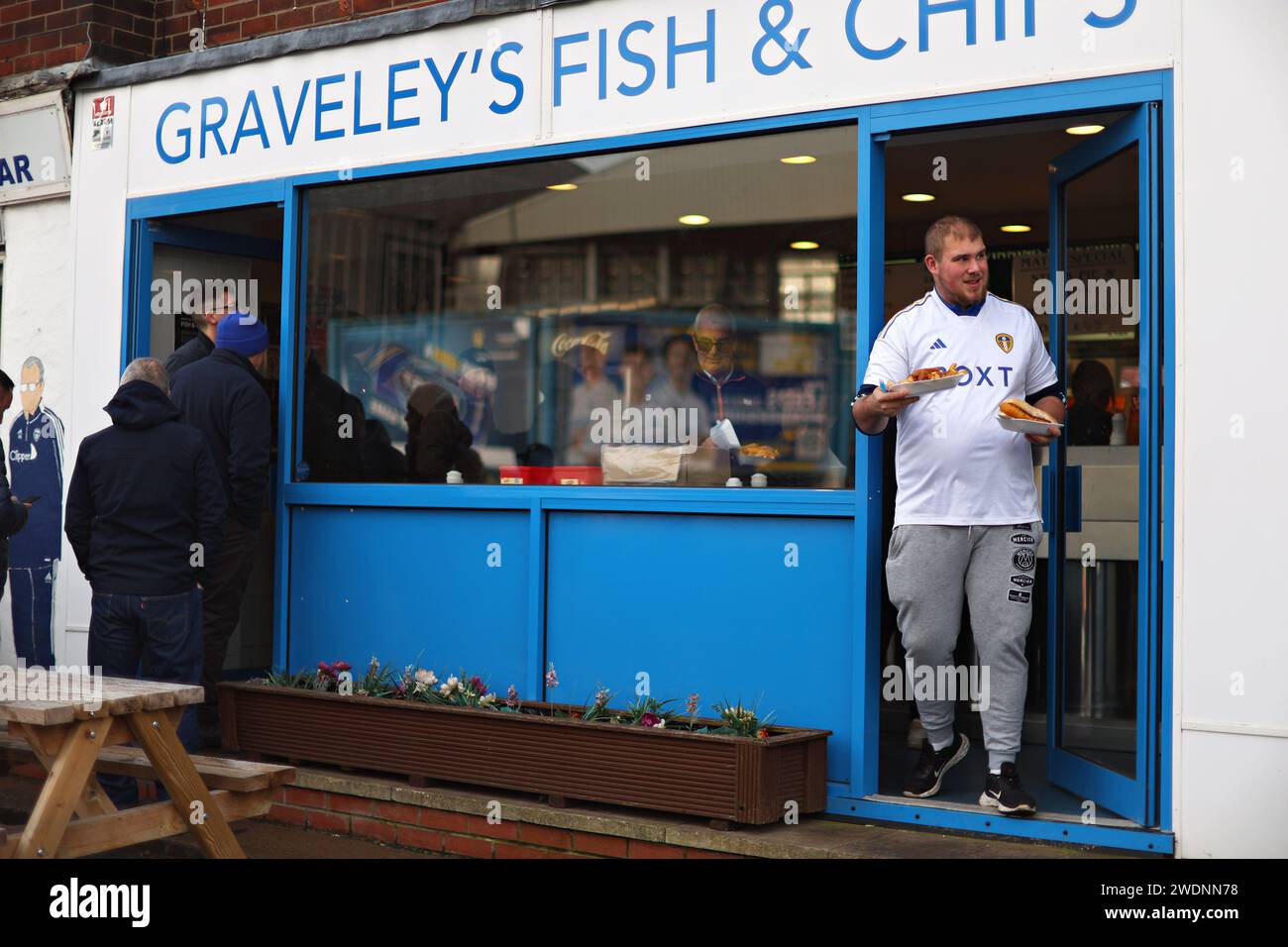 Leeds, UK. 21st Jan, 2024. Fans have Fish & Chips before making their ...