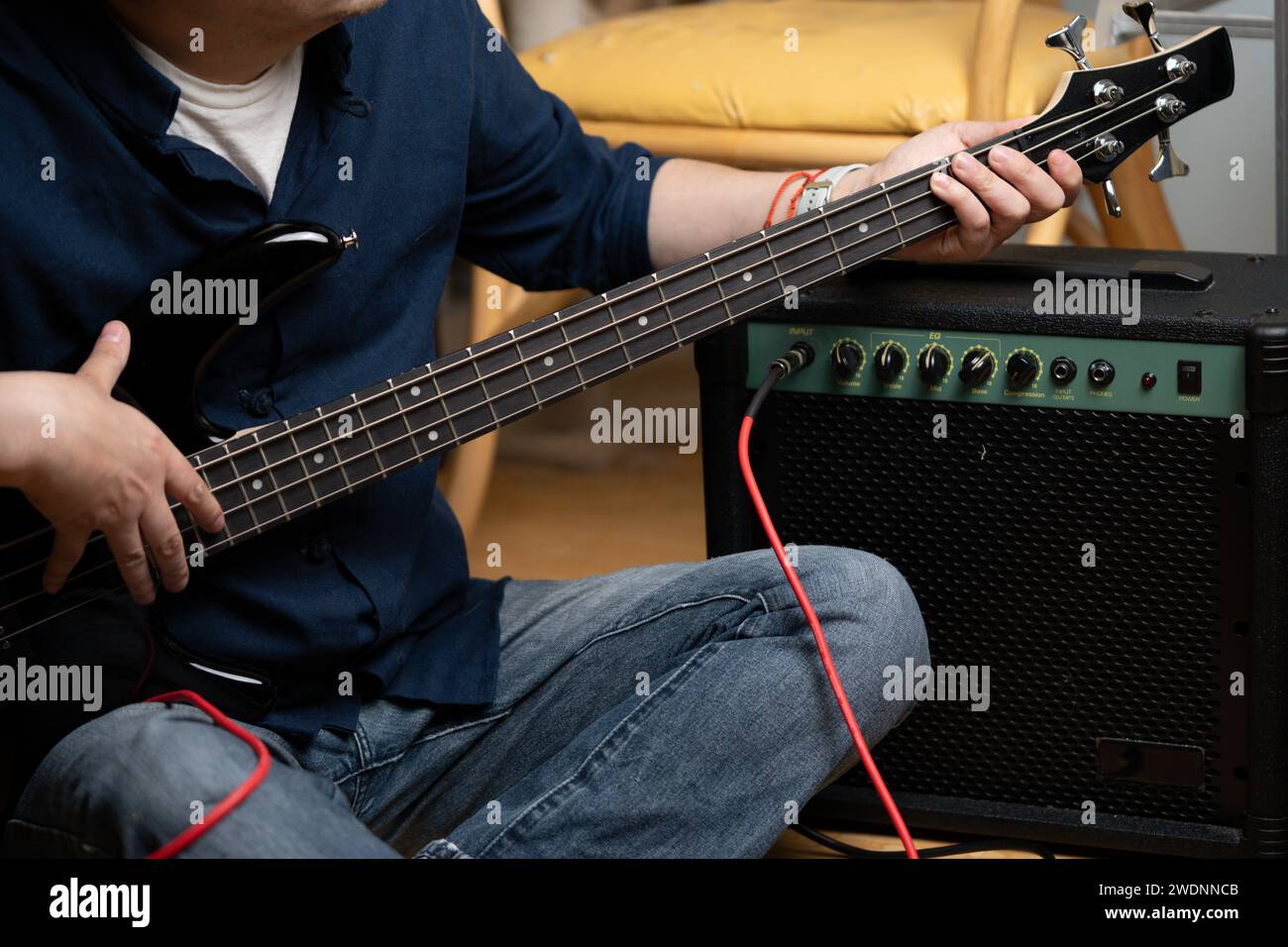 latin man learning to play electric bass hands movements Stock Photo ...