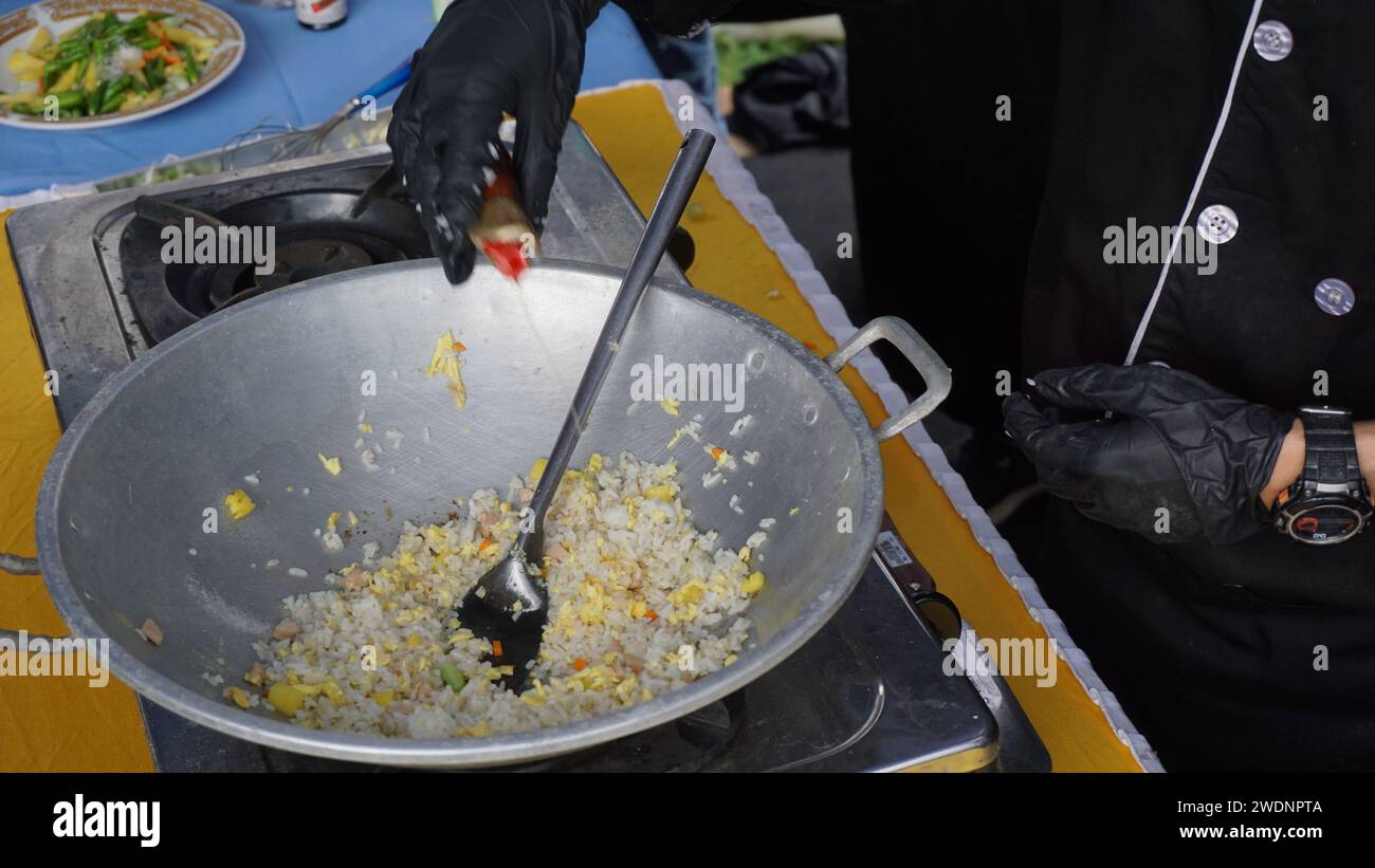 The chef cooking fried rice. Fried rice is one of indonesian famous ...