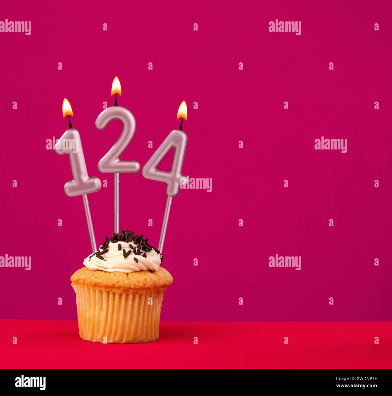 Candle number 124 - Cake birthday in rhodamine red background Stock ...