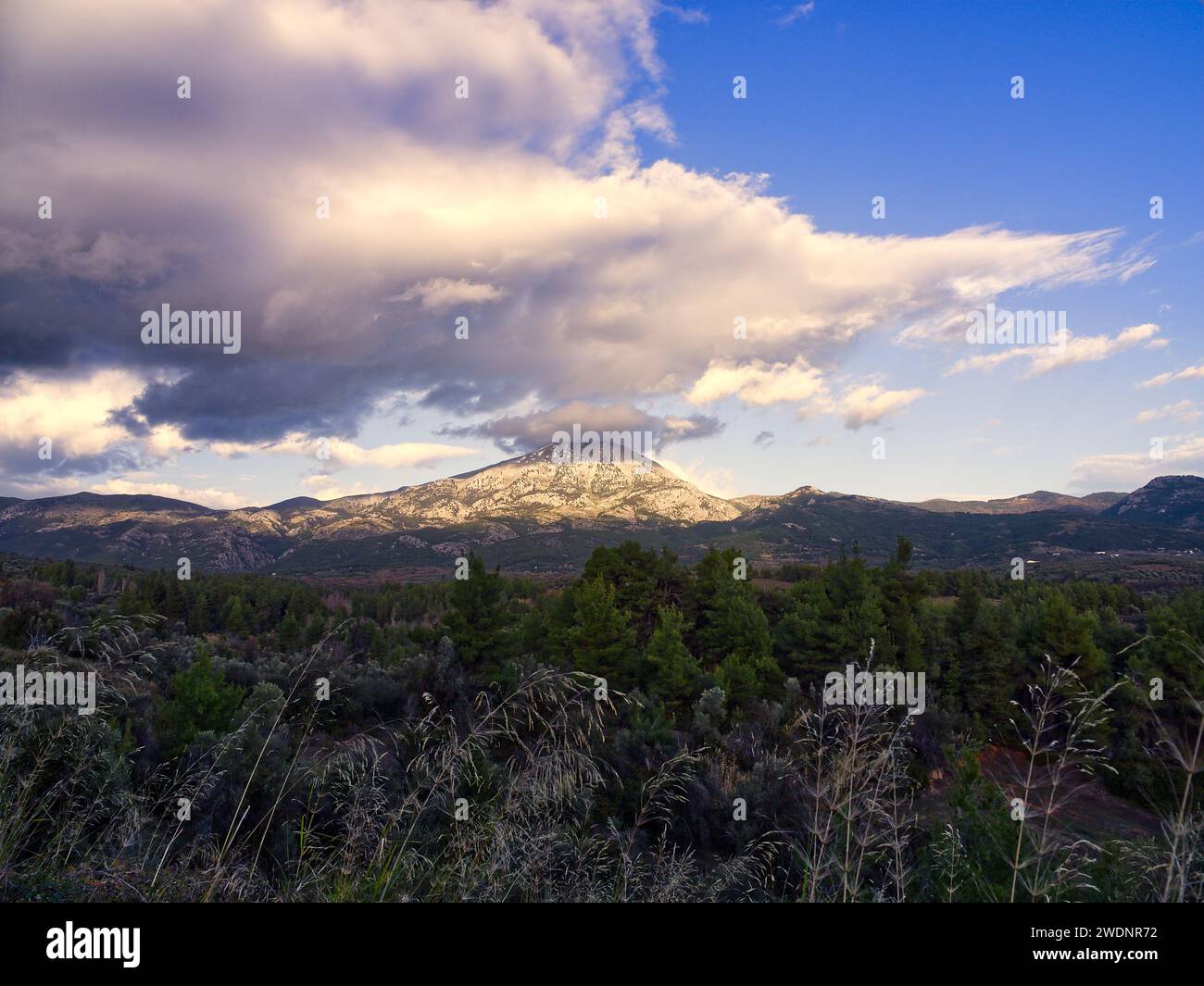 Mountain peak in sunset clouds. Dirfi mountain is located in Euboea ...