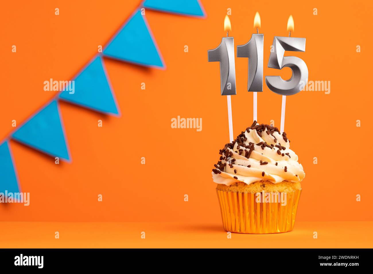 Candle number 115 - Cake birthday in orange background Stock Photo - Alamy