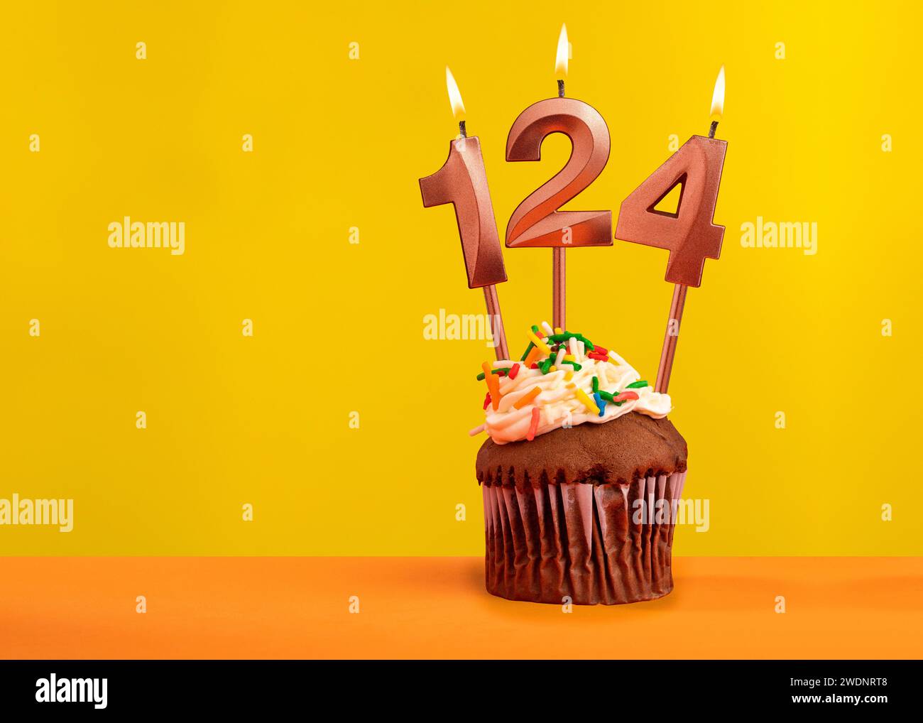 Number 124 birthday candle - Celebration on yellow background Stock ...