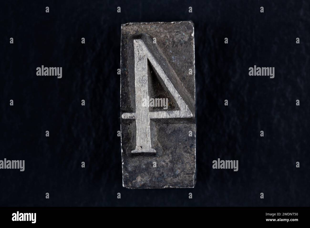 Antique vintage movable type alphabet number 4. on black background ...