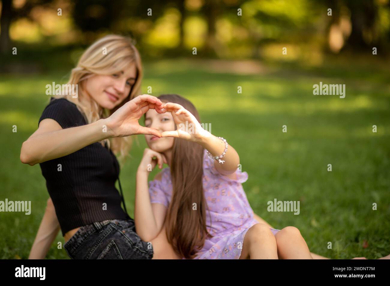 Daughter mother making heart hi-res stock photography and images - Alamy