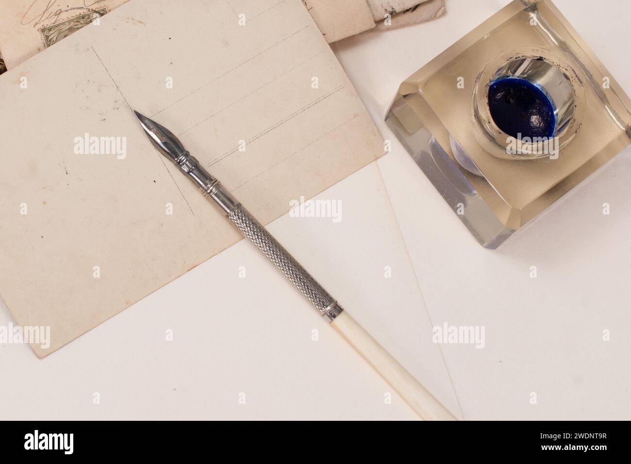 Vintage background with old ink pen, handwrite letters and old ink pot ...