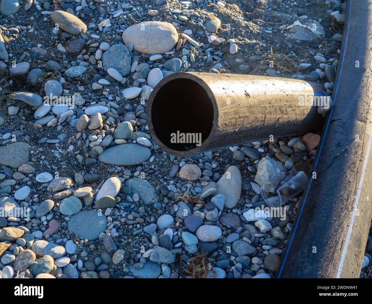 pipe with communications was dug on pebble soil. Electrical networks in ...
