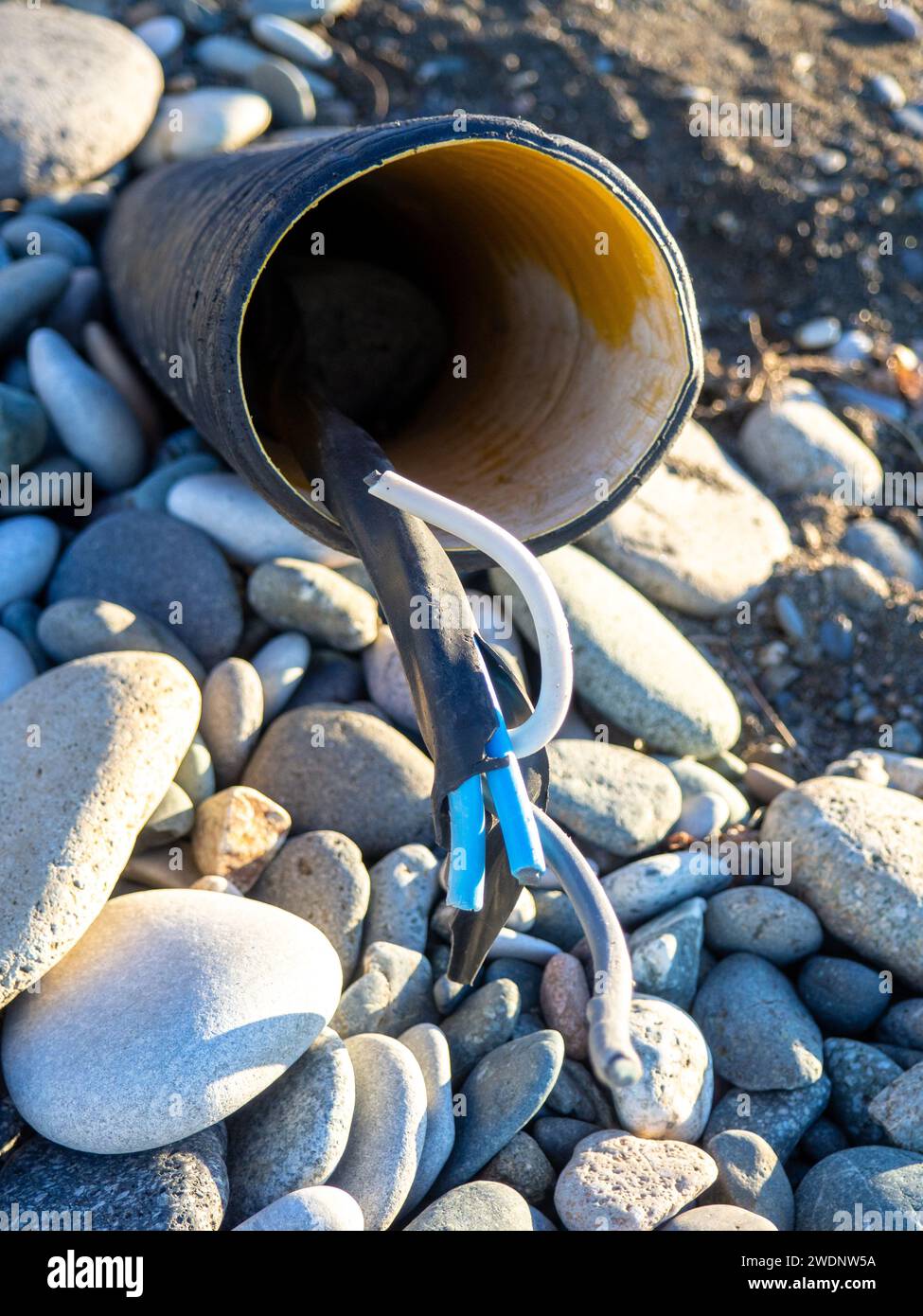 pipe with communications was dug on pebble soil. Electrical networks in ...