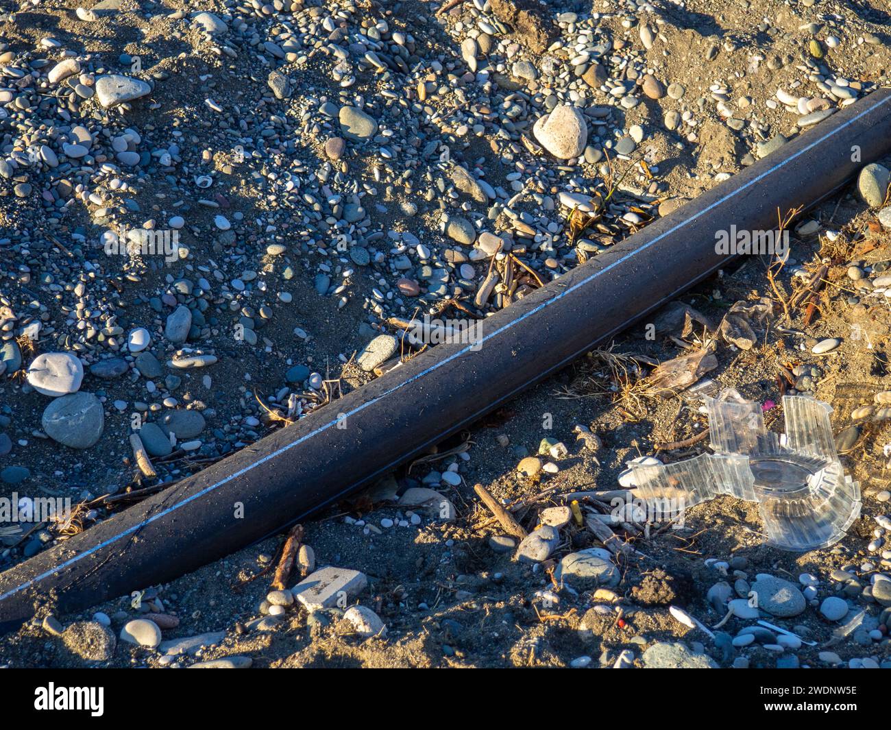 pipe with communications was dug on pebble soil. Electrical networks in ...