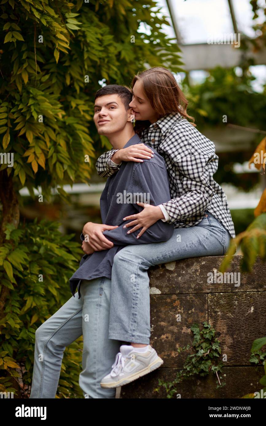 Love's Moments: A Young Cute Female Hugs Her Boyfriend in the ...