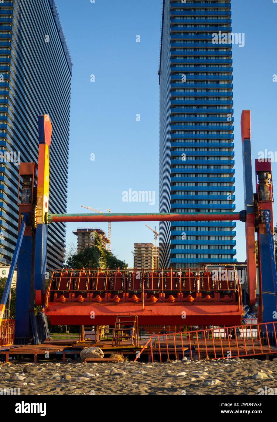 Closed amusement park for the winter. Amusement park in a modern city ...